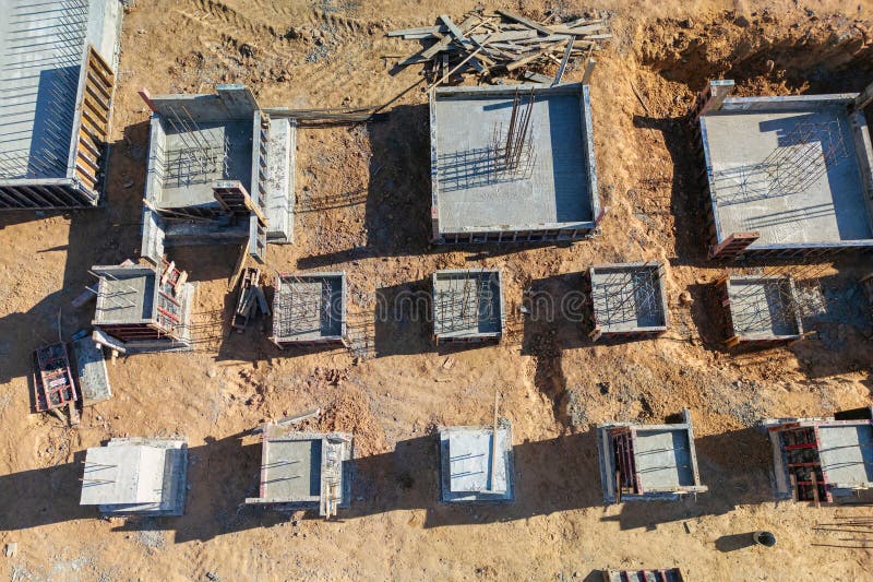 A Group of Concrete Blocks Arranged on Top of a Dirt Field in a ...
