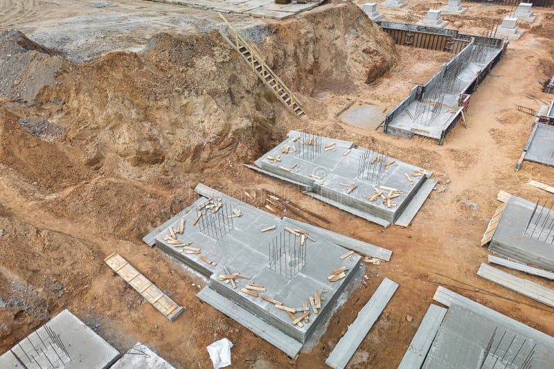 A Group of Concrete Blocks Gracefully Arranged on a Dirt Field, Forming ...
