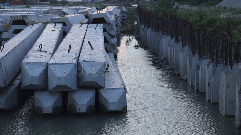 A Group of Concrete Blocks are on the Water Stock Photo - Image of ...
