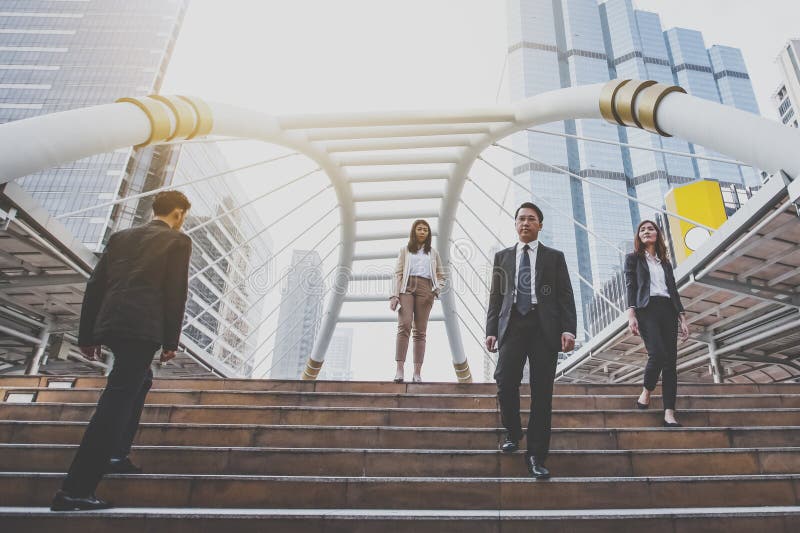 Group of Confident Businessman Going Down and Walking on Stairs ...
