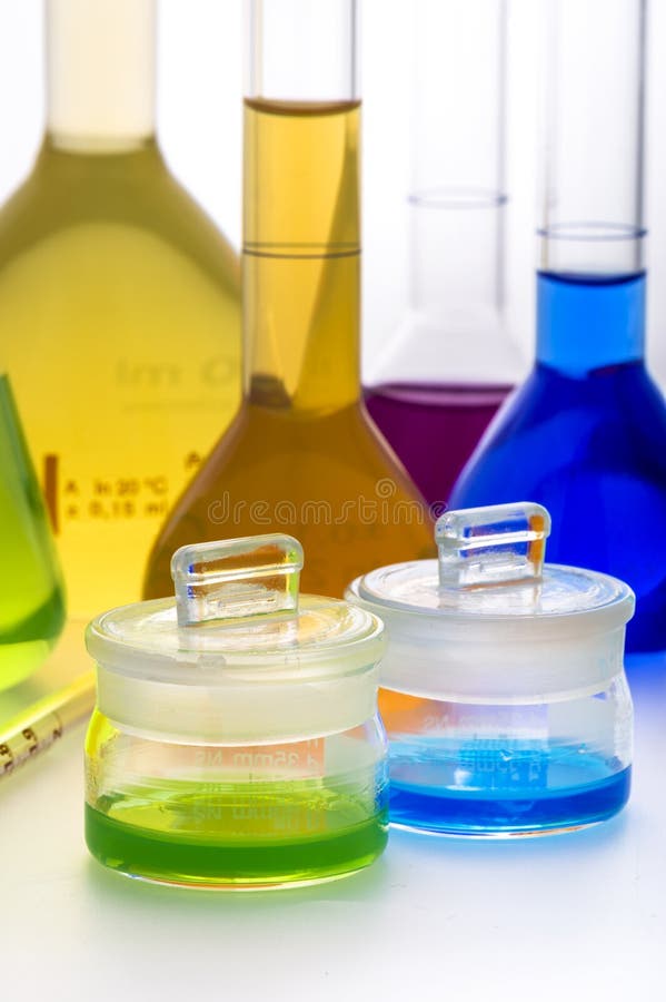 Tubes and Flask with Plant Extract and Colored Liquids on Table of Lab ...