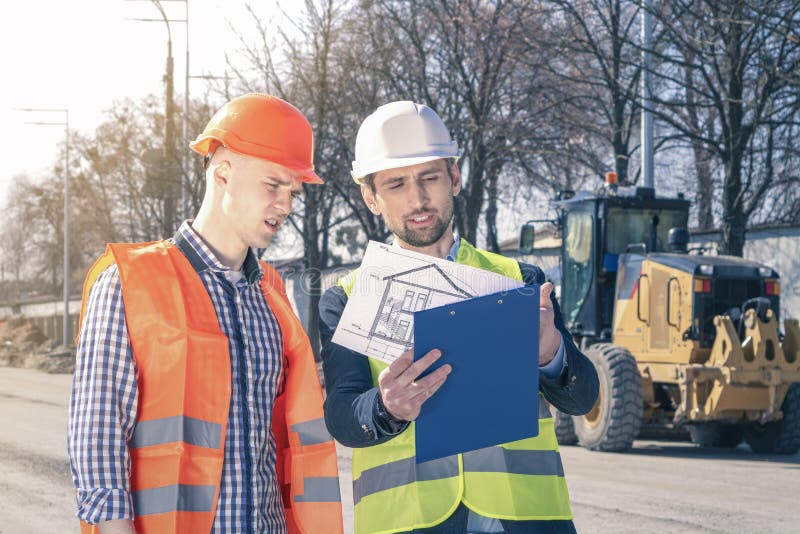 Group of Construction Engineers on a Building Plot. Engineers ...