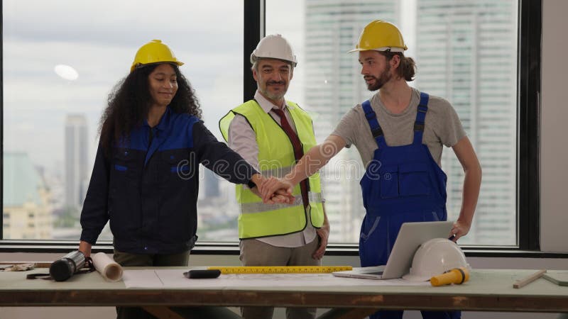 Group of Construction Engineers Touching and Stacking Hands Supporting ...
