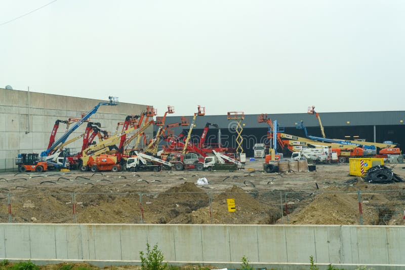 Group of Construction Equipment in Front of Building Editorial Image ...