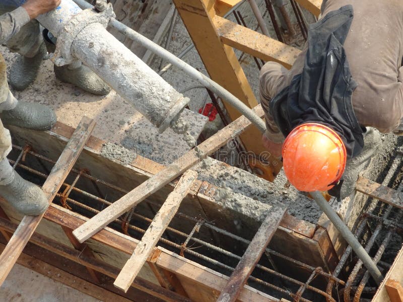 Group of Construction Workers Pouring Wet Concrete Using the Concrete ...