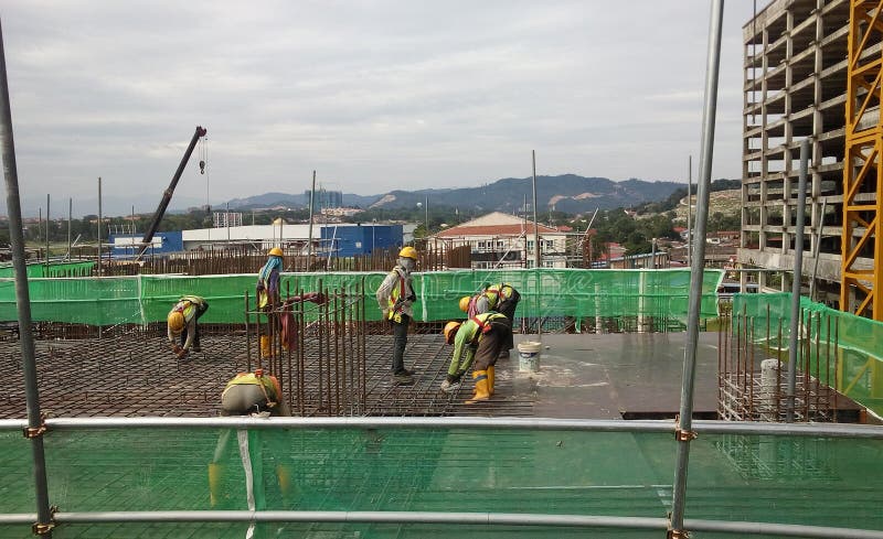 Group of Construction Workers Working at the Construction Site. the ...