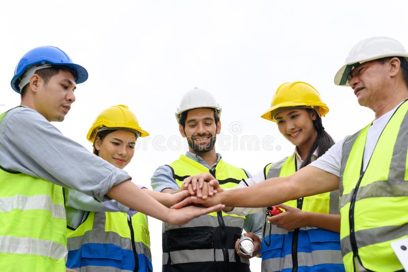 Construction Engineer and Architect with Blueprint Shaking Hands while ...