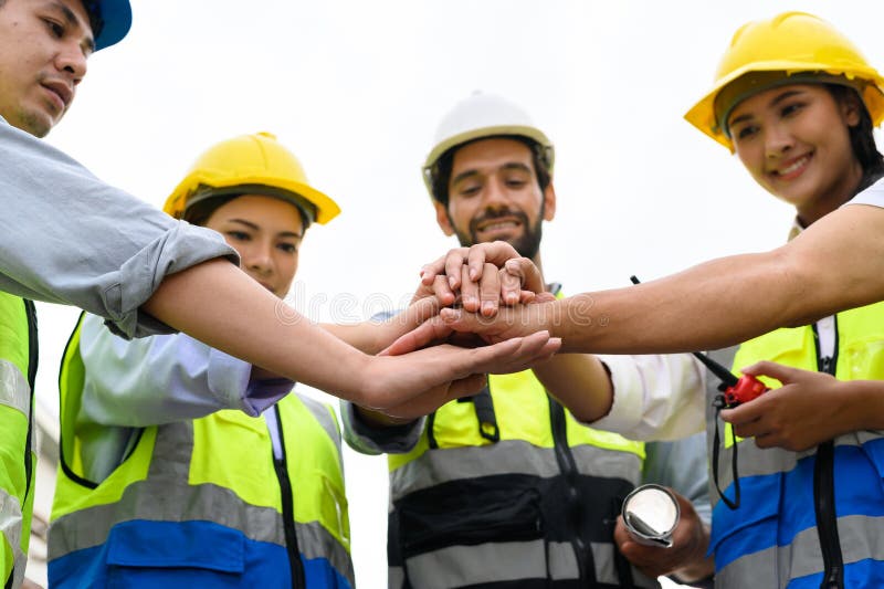 Construction Engineer and Architect with Blueprint Shaking Hands while ...