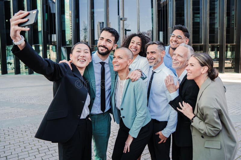 Group Of A Corporate Business People Smiling And Taking A Selfie
