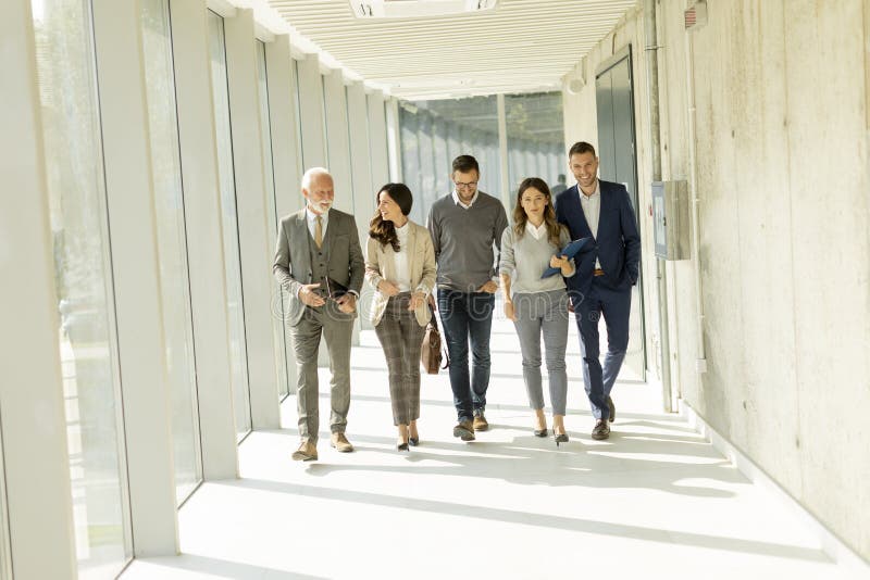 Group of Corporate Business Professionals Walking through Office ...