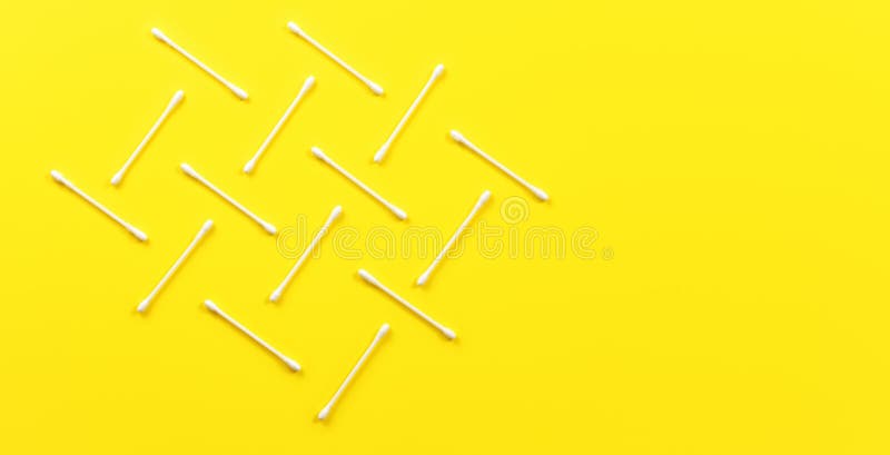 Group of Cotton Buds or Swabs Arranged in Pattern Over Light Yellow ...