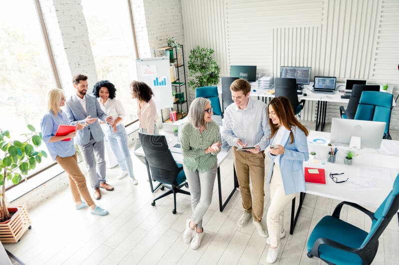 Diverse Team of Professionals Collaborating in a Modern, Bright Office ...