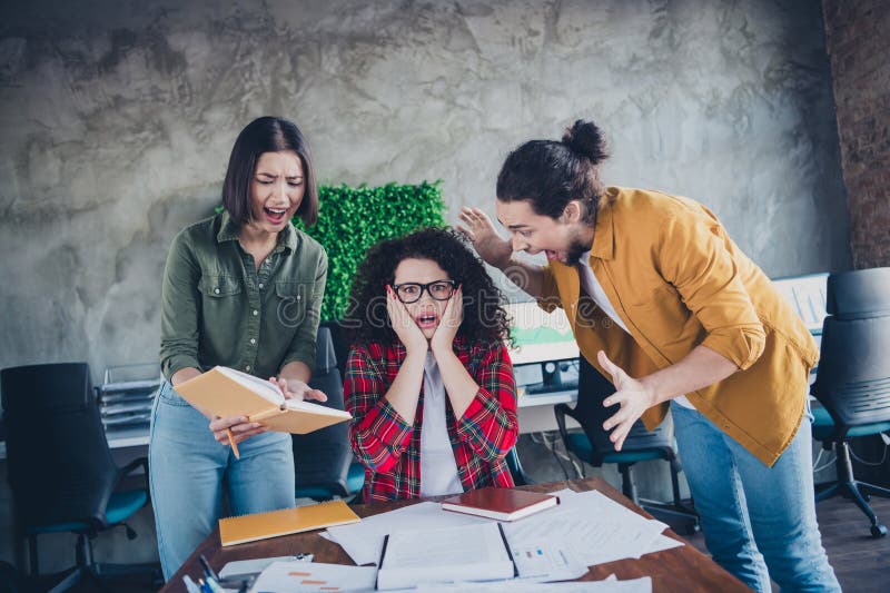 Group of Coworkers in an Office Discussing Paperwork while Experiencing ...