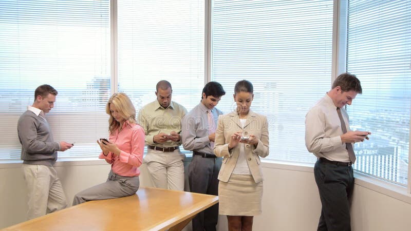 Group of Coworkers Texting in Office Stock Footage - Video of cellphone ...