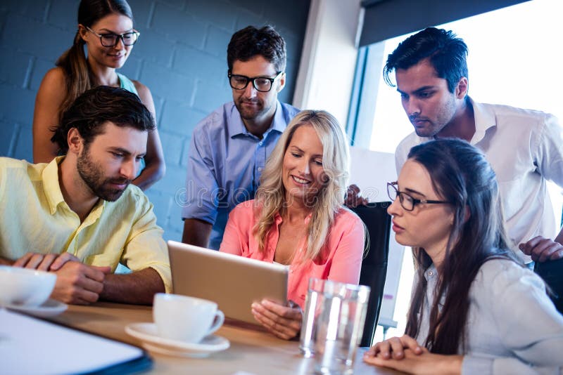 Group of Coworkers Watching a Tablet Computer Stock Image - Image of ...