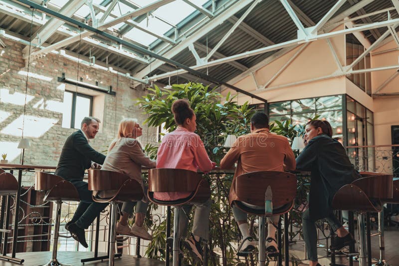 Group of Coworkers Working Together and Talking at Modern Office ...