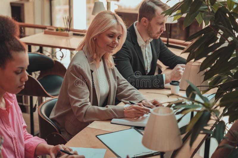 Group of Coworkers Working Together and Talking at Modern Office ...