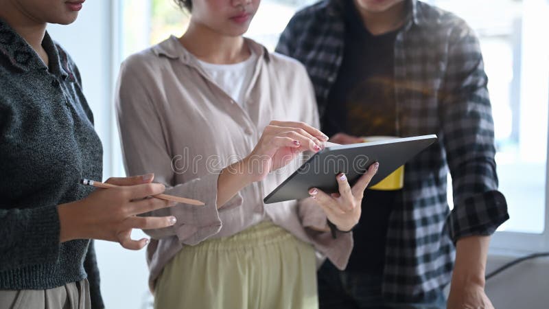 Group of Creative Designer Using Digital Tablet and Discussing New ...
