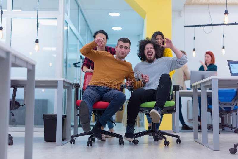 Group Of Creative Office Workers Collaborate Together Making Joke With ...