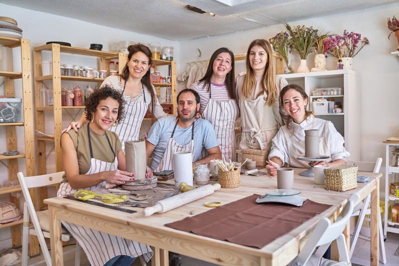 Group of Creative People Posing Together while Having Fun in a Pottery ...