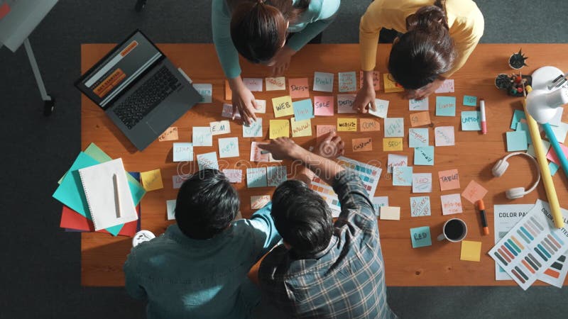 Group of Creative Team Look and Plan Idea while Manager Hold Notes ...