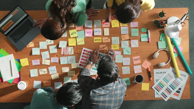 Group of Creative Team Look and Plan Idea while Manager Hold Notes ...