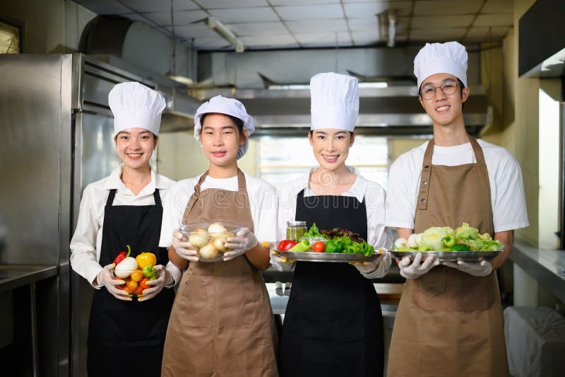 Group of Culinary Students Proudly Holding Fresh Vegetables, Ready for ...