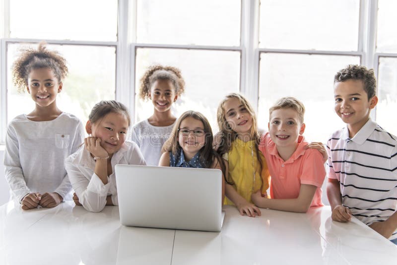 Group of Curious Children Watching Stuff on the Laptop Screen Stock ...