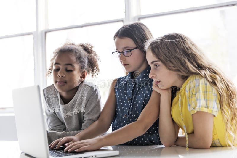 Group of Curious Children Watching Stuff on the Laptop Screen Stock ...