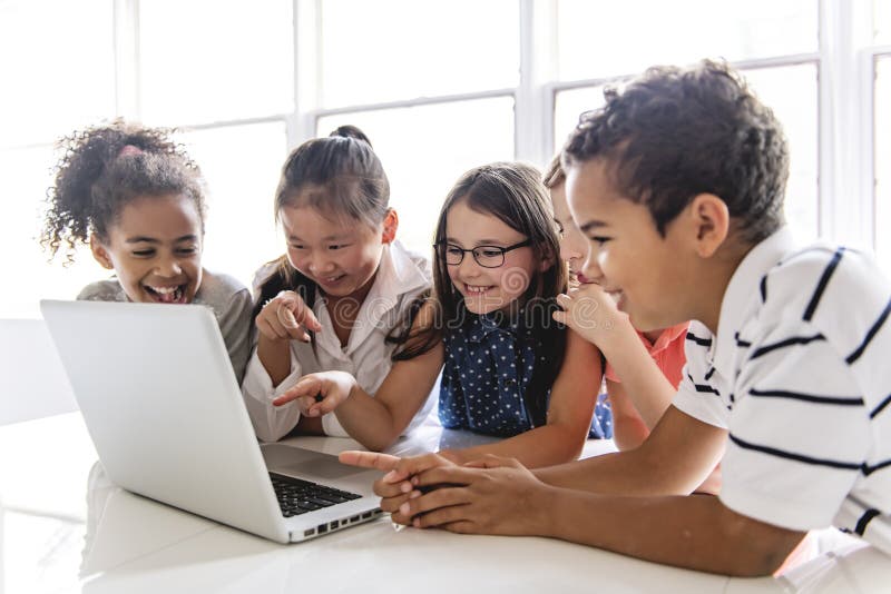 Group of Curious Children Watching Stuff on the Laptop Screen Stock ...