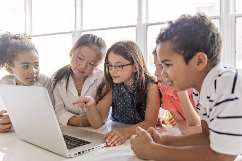 Group of Curious Children Watching Stuff on the Laptop Screen Stock ...