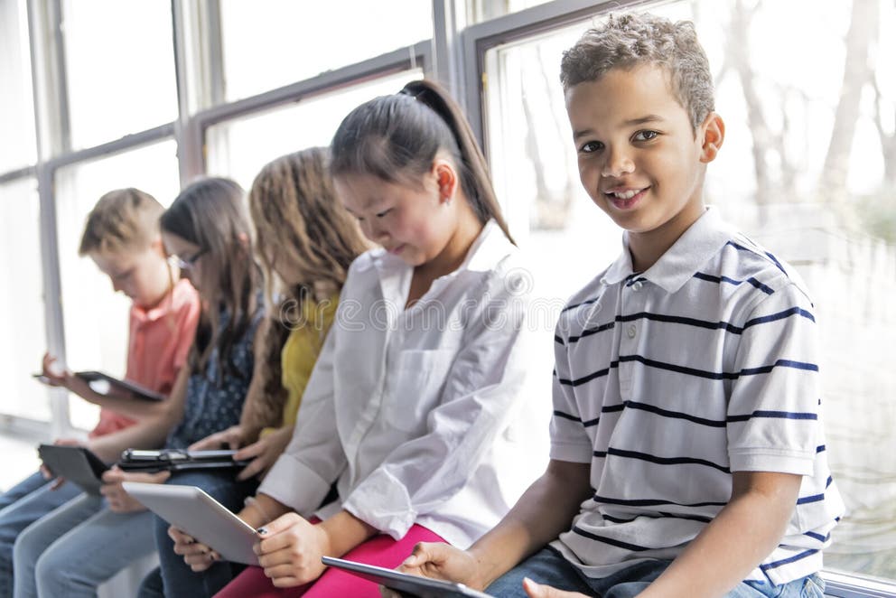 Group of Curious Children Watching Stuff on the Tablet Screen Stock ...