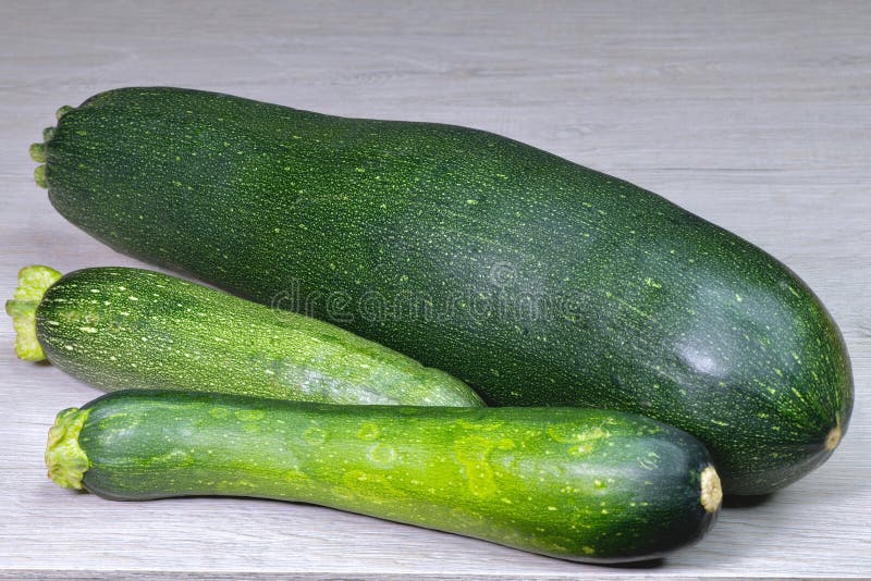 A Group of Cut Fresh Zucchini in the Skin on a Light Table Stock Image ...