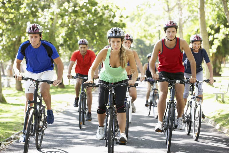 Group of Cyclists on Cycle Ride through Park Stock Photo - Image of ...