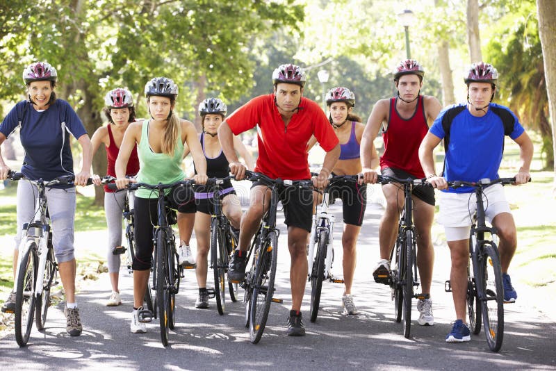 Group of Cyclists on Cycle Ride through Park Stock Photo - Image of ...