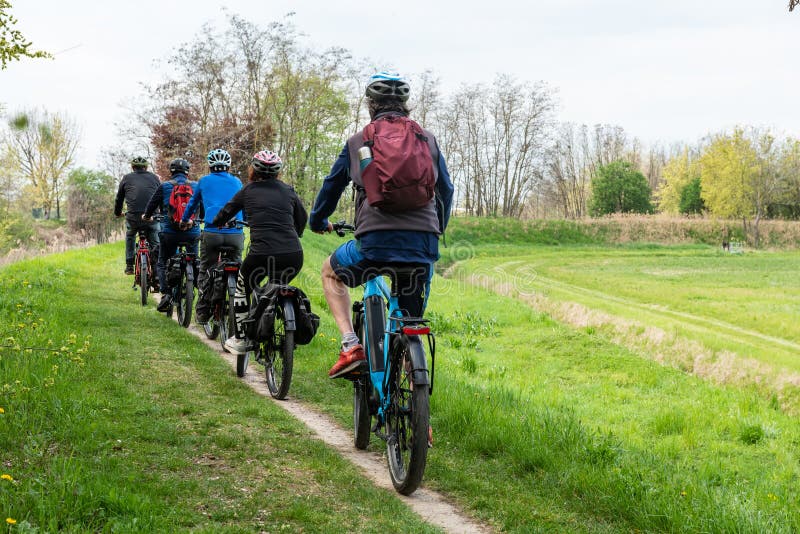 A group of cyclists riding editorial stock image. Image of biker ...