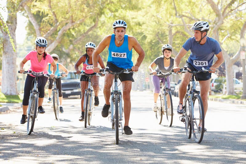 Group of Cyclists on Suburban Street Stock Photo - Image of cyclist ...