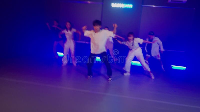 Group Dance Performance in a Studio with Blue Lighting Stock Video ...