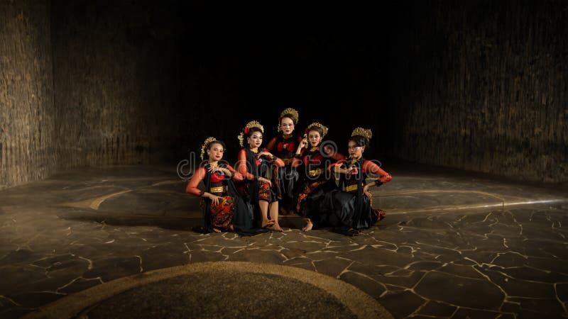 A Group of Dancers Attract Attention in Striking Red Costumes and Sit ...