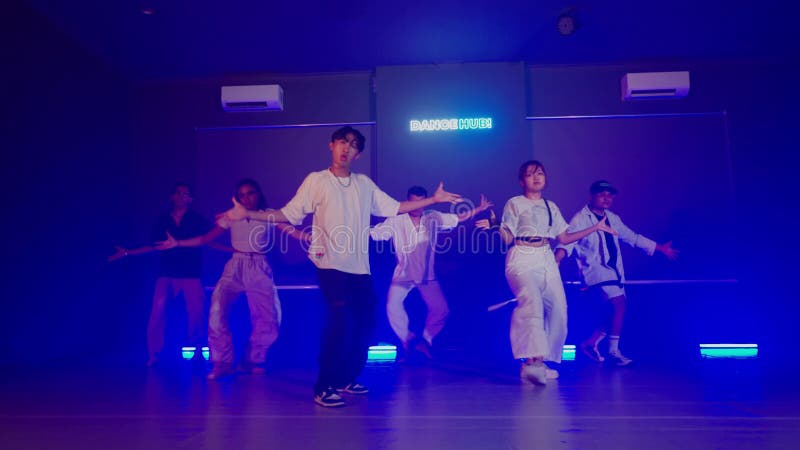 Group of Dancers Performing in a Studio with Blue Lighting Stock ...