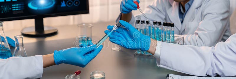 Group of Dedicated Scientist Conduct Chemical Experiments in Lab ...
