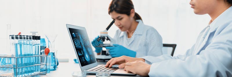 Group of Dedicated Scientist Conduct Chemical Experiments in Lab ...