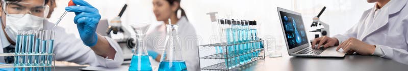 Group of Dedicated Scientist Conduct Chemical Experiments in Lab ...