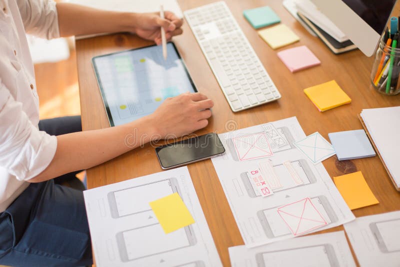 Group of Designer , or Programmer Drawing Website UX Layout App ...