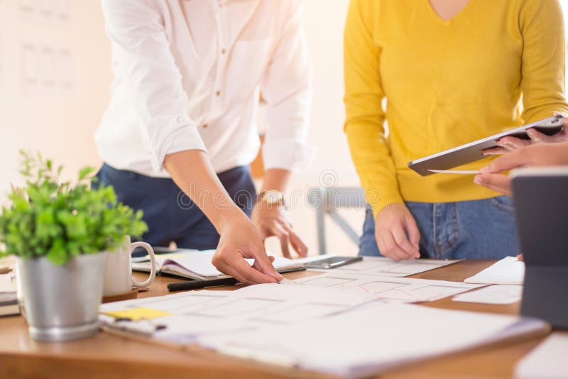 Group of Designer , or Programmer Drawing Website UX Layout App ...