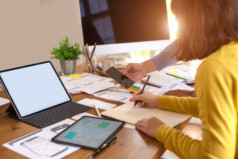 Group of Designer , or Programmer Drawing Website UX Layout App ...