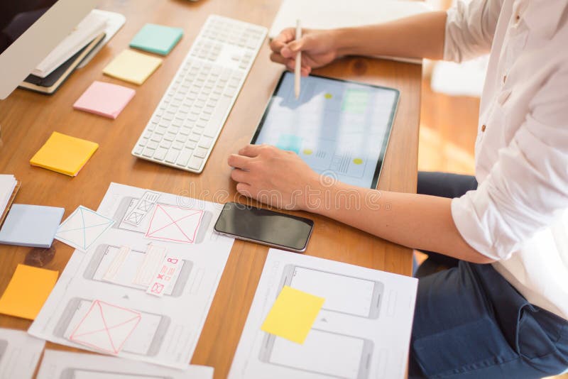 Group of Designer , or Programmer Drawing Website UX Layout App ...