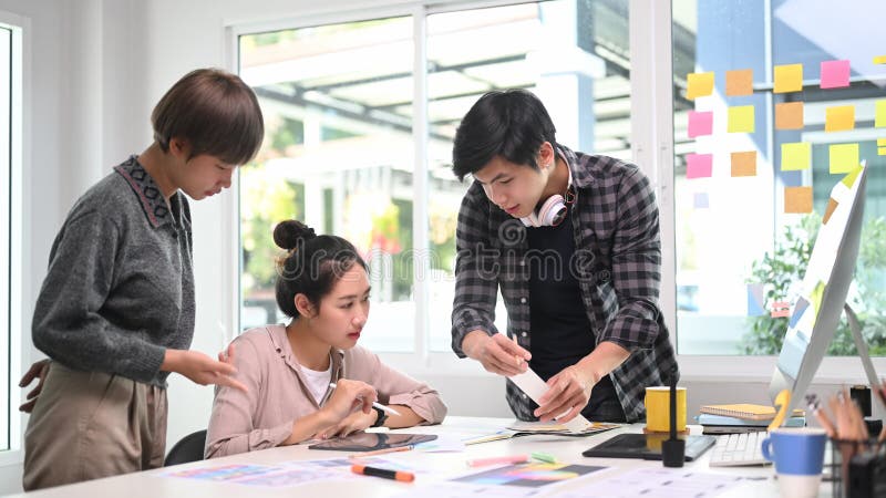 Group of Designers in Casual Clothes Working on Project Together and ...