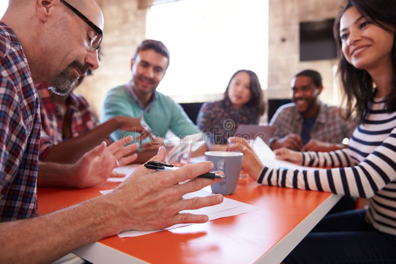 Group of Designers Having Meeting Around Table in Office Stock Image ...