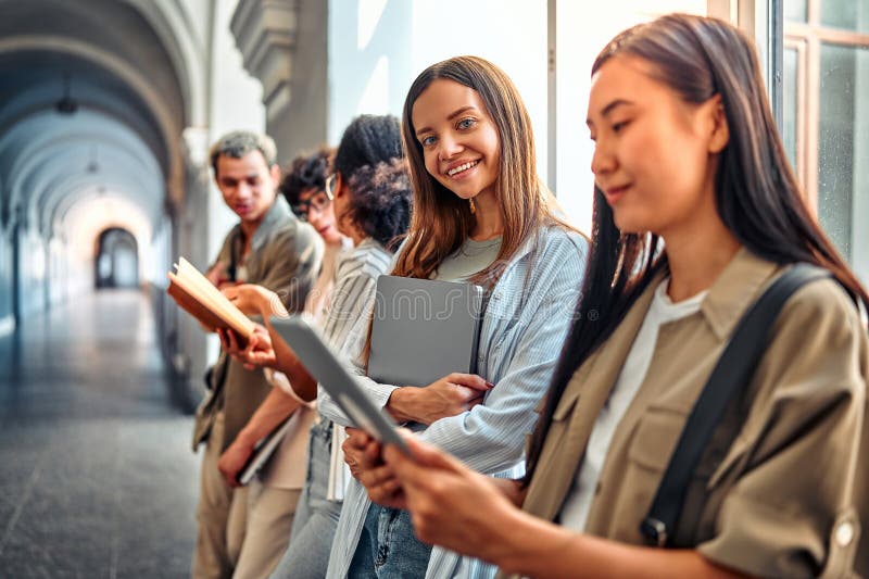 A Group of Different Students are Standing in a Corridor. Stock Photo ...